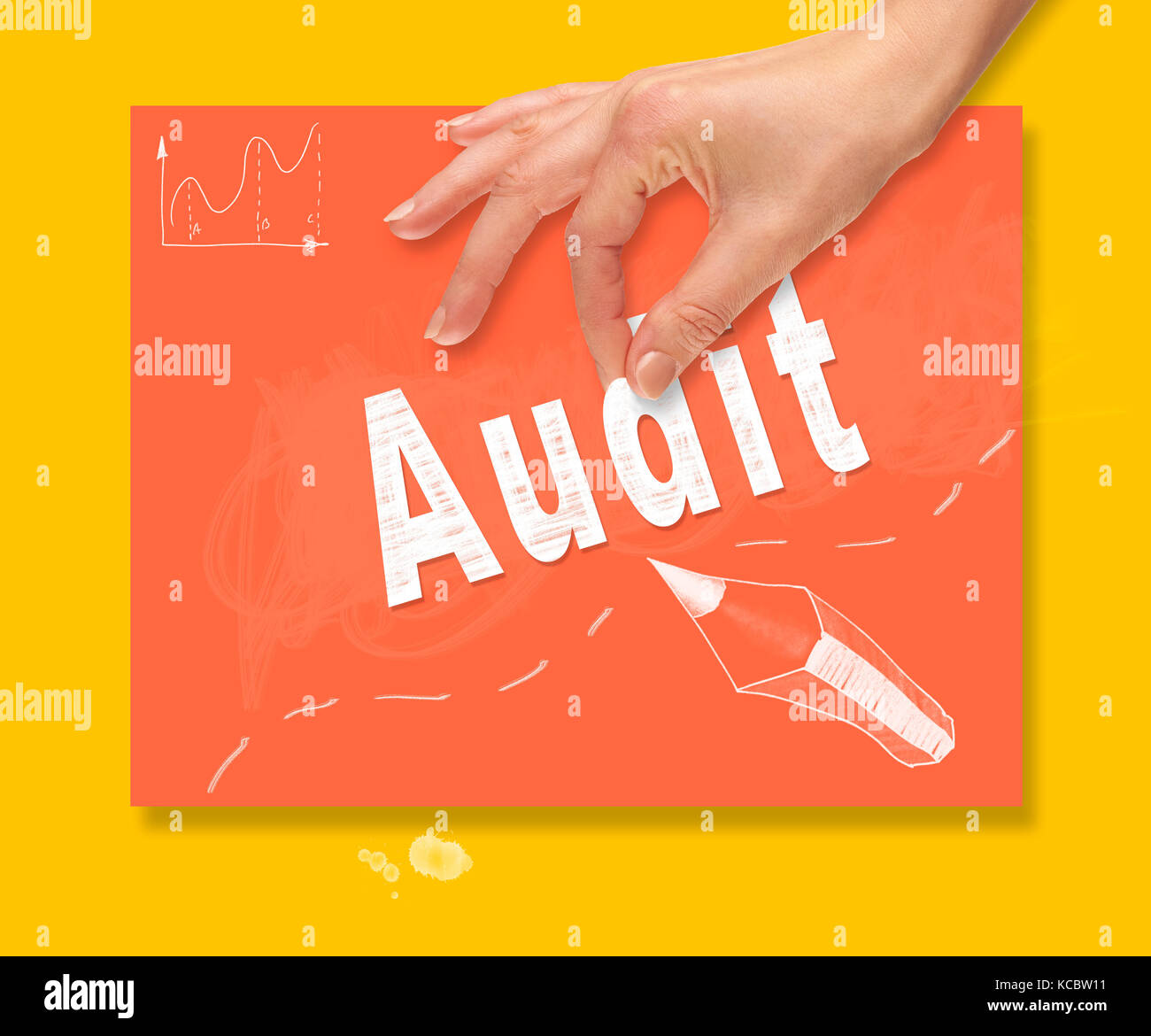 A hand picking up a Audit concept on a colorful drawing board Stock ...