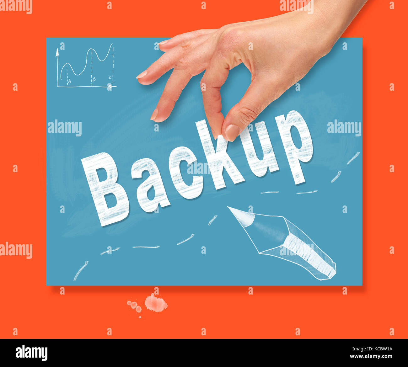 A hand picking up a Backup concept on a portable computer Stock Photo ...
