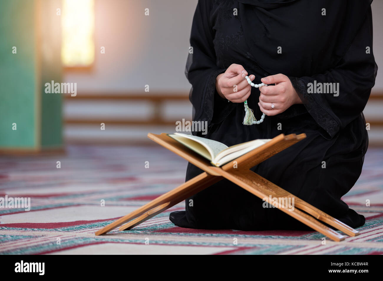 Young muslim woman praying in mosque Stock Photo - Alamy
