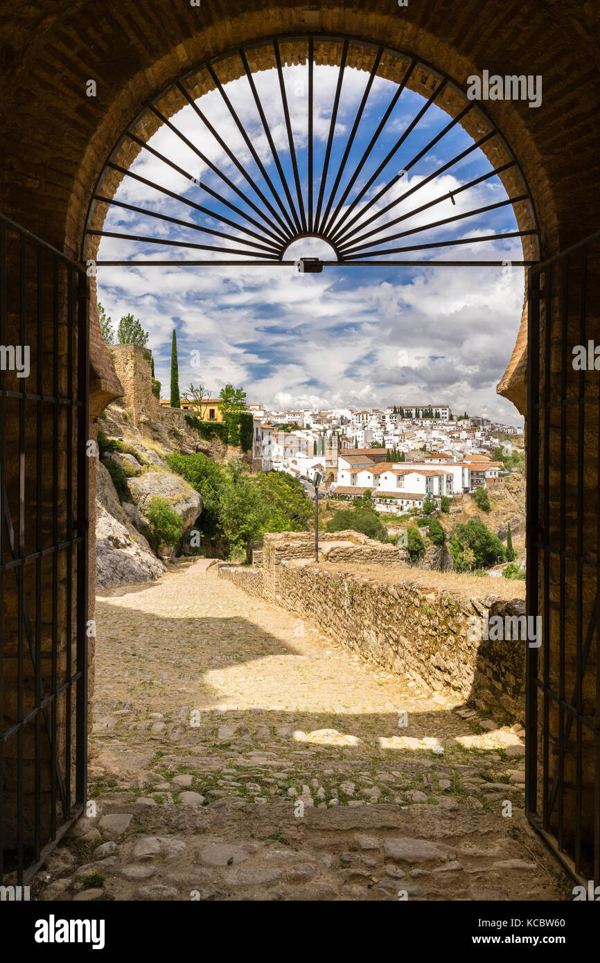 View through city gate to the old town of La Ciudad, Ronda, province of ...