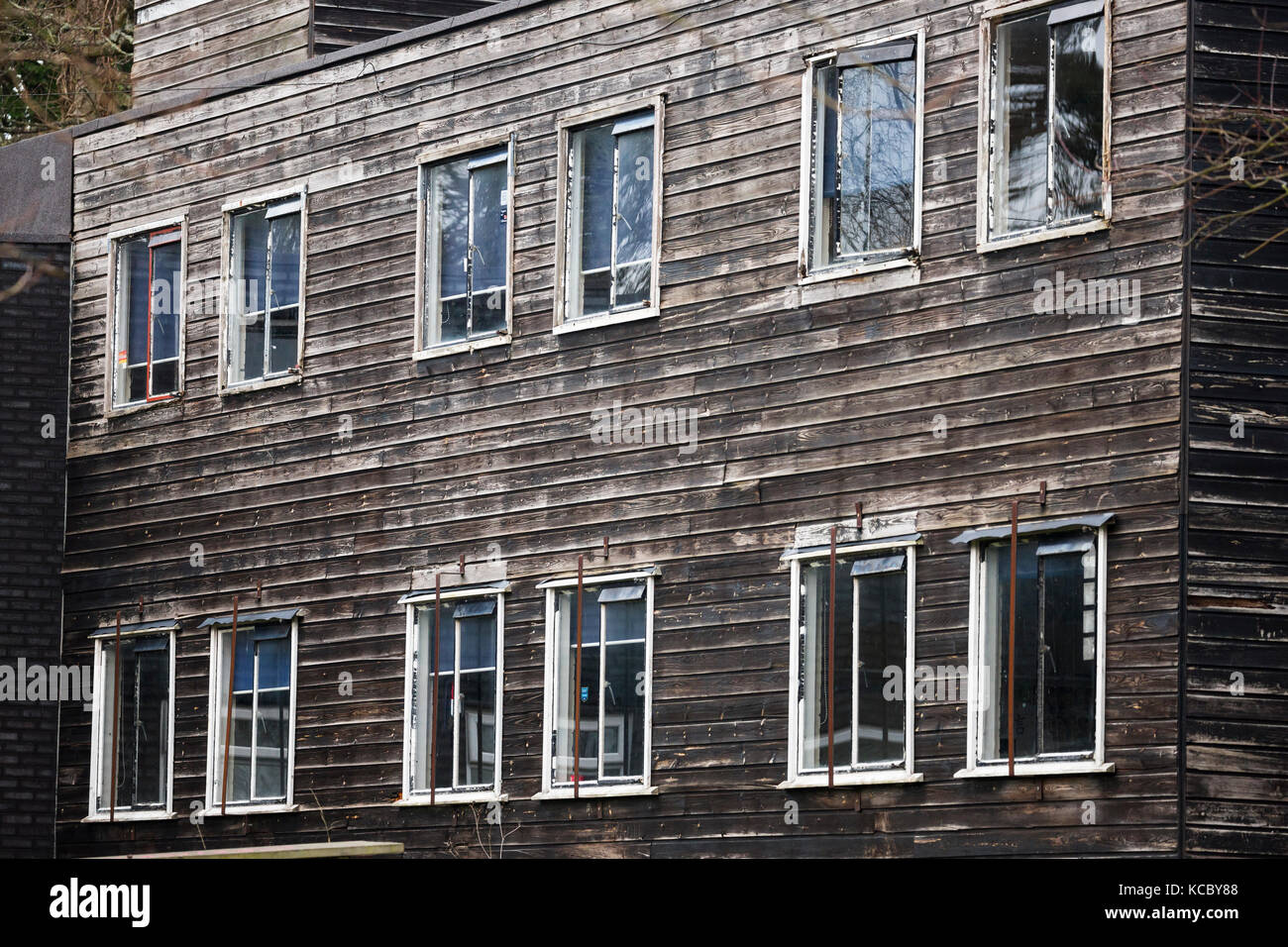 weathered wooden slatted two storey building Stock Photo - Alamy