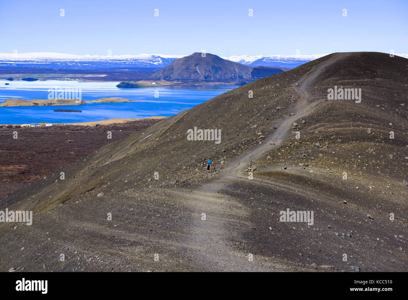 Hiker at Hverfell (also called Hverfjall) tephra cone or tuff ring ...