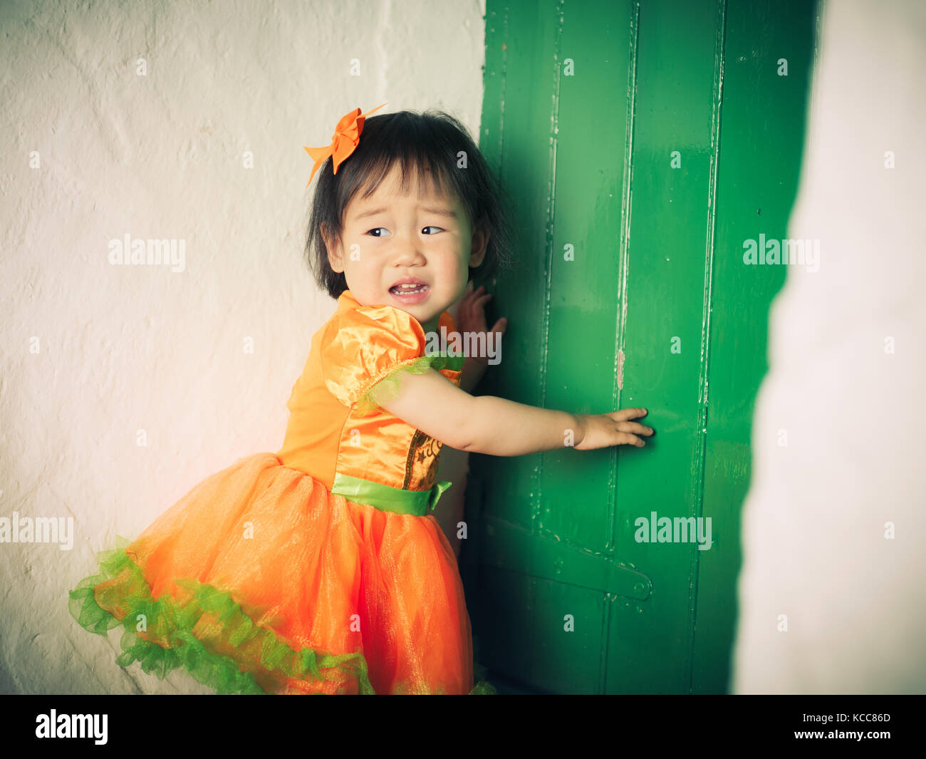Baby girl crying on her first halloween party Stock Photo - Alamy
