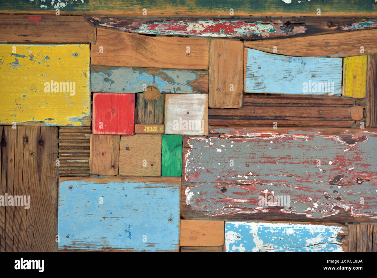 a shabby chic patchwork of painted wooden blocks making an abstract ...