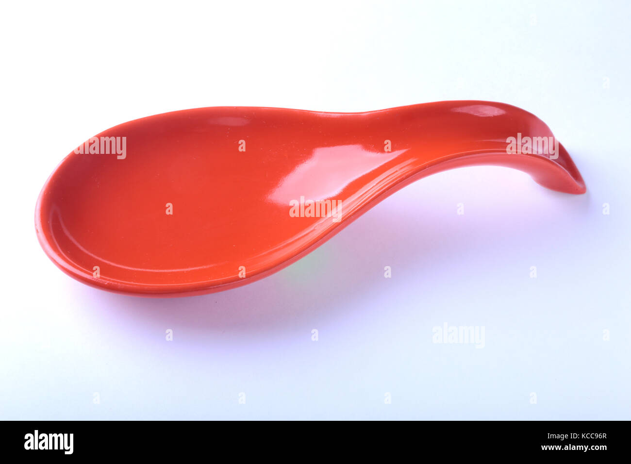 red portionen plate. isolated on white. selective focus close-up shot ...