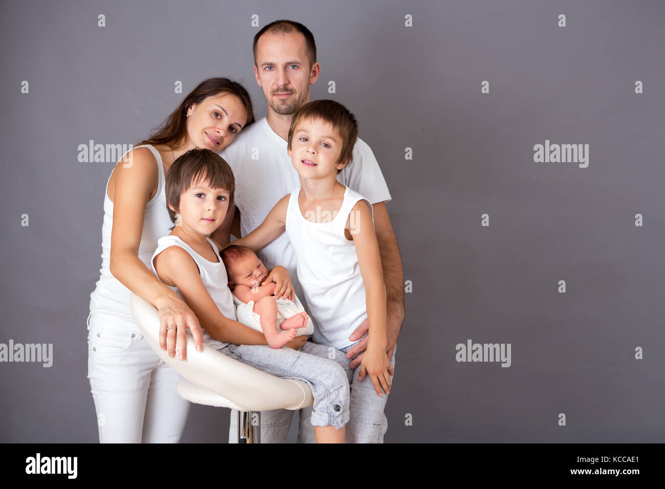 Beautiful family portrait, father, mother and three boys, looking ...