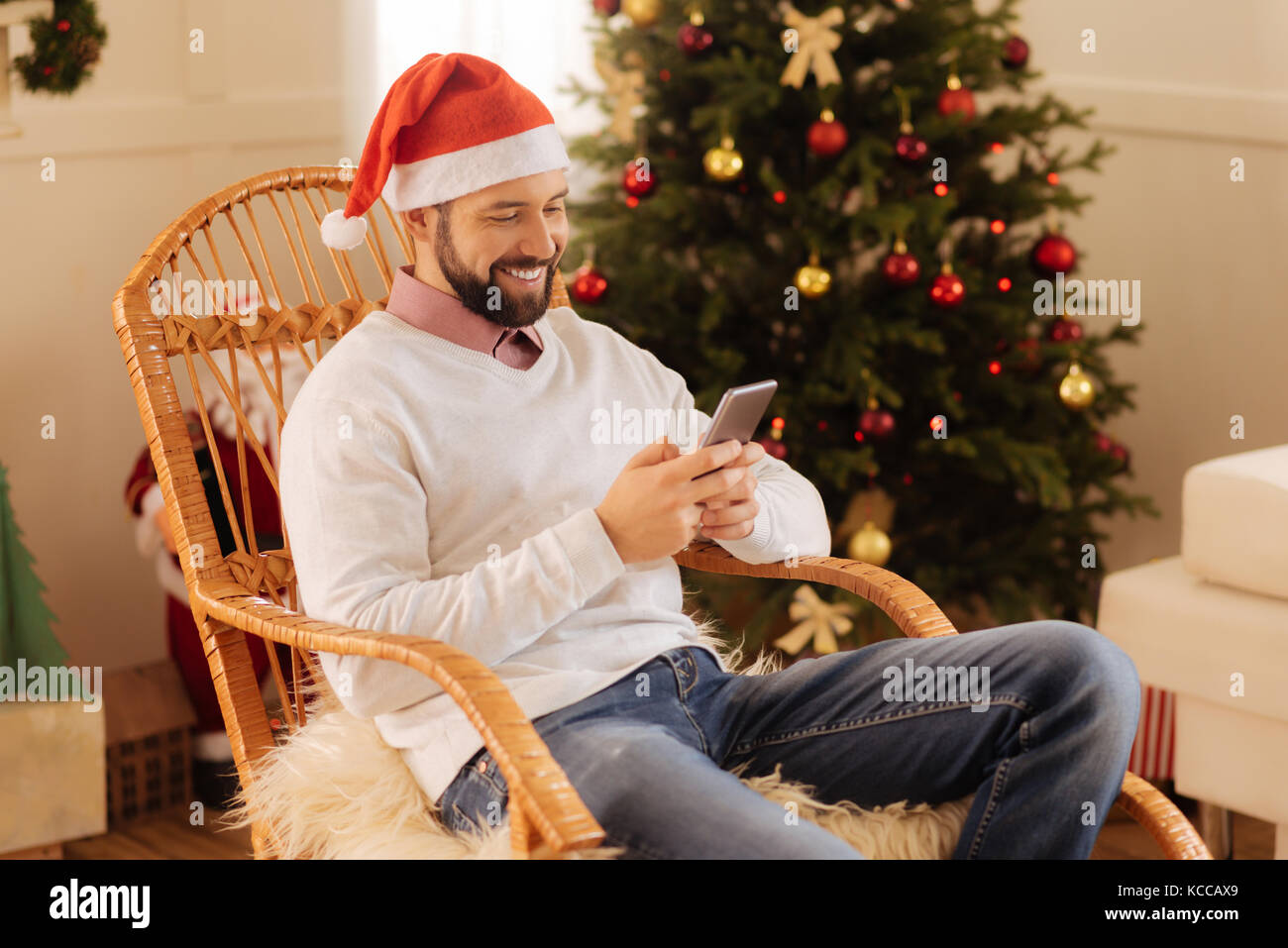 Upbeat man sitting in rocking chair and chatting Stock Photo - Alamy
