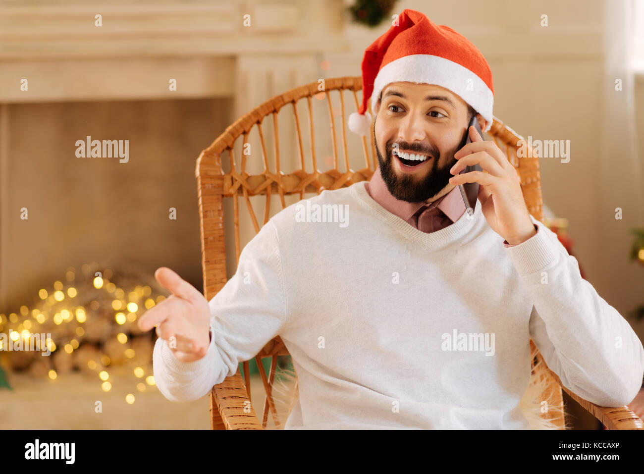 Lively man being surprised while talking on the phone Stock Photo - Alamy