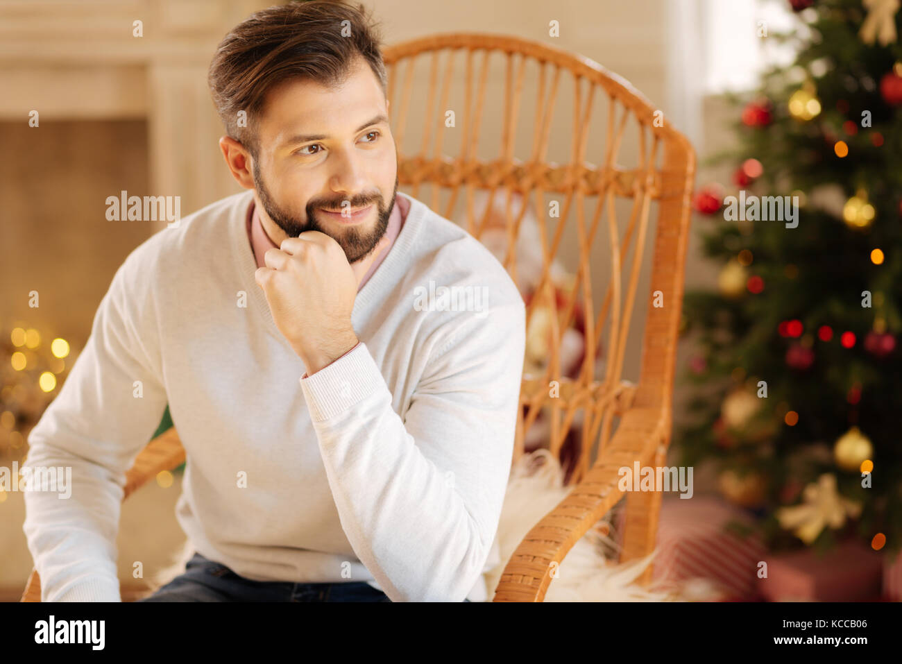 Handsome man sitting in a rocking chair Stock Photo - Alamy