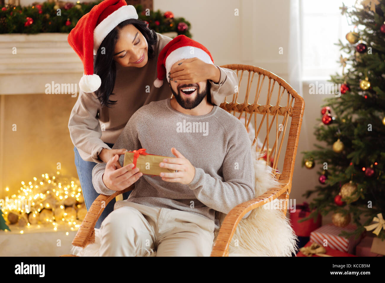 Caring woman making a surprise for her husband Stock Photo - Alamy