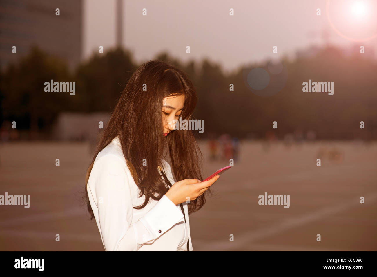 Women use a mobile phone in the night of the street Stock Photo - Alamy