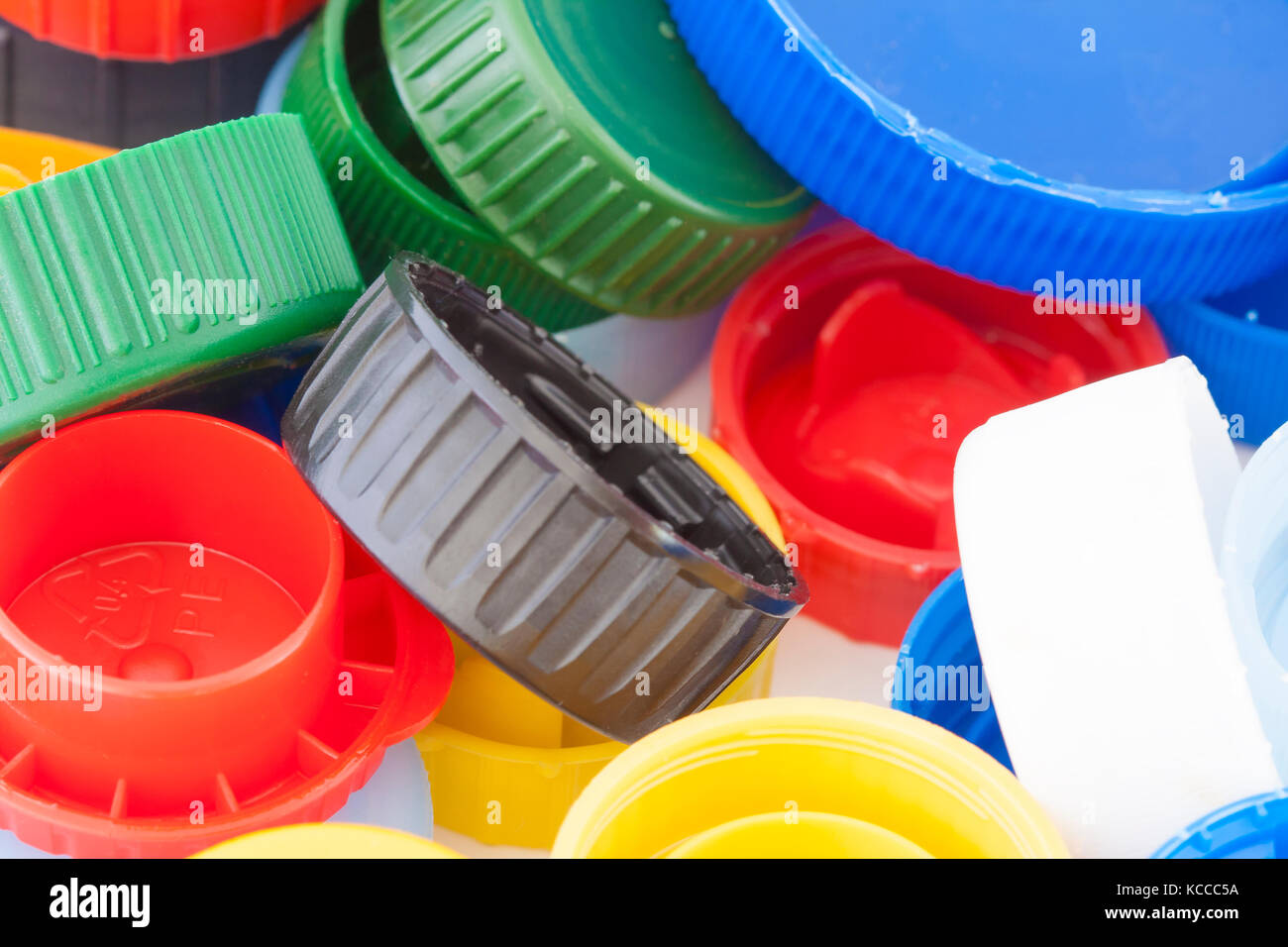 Colorful plastic bottle caps closeup, recycled garbage Stock Photo - Alamy