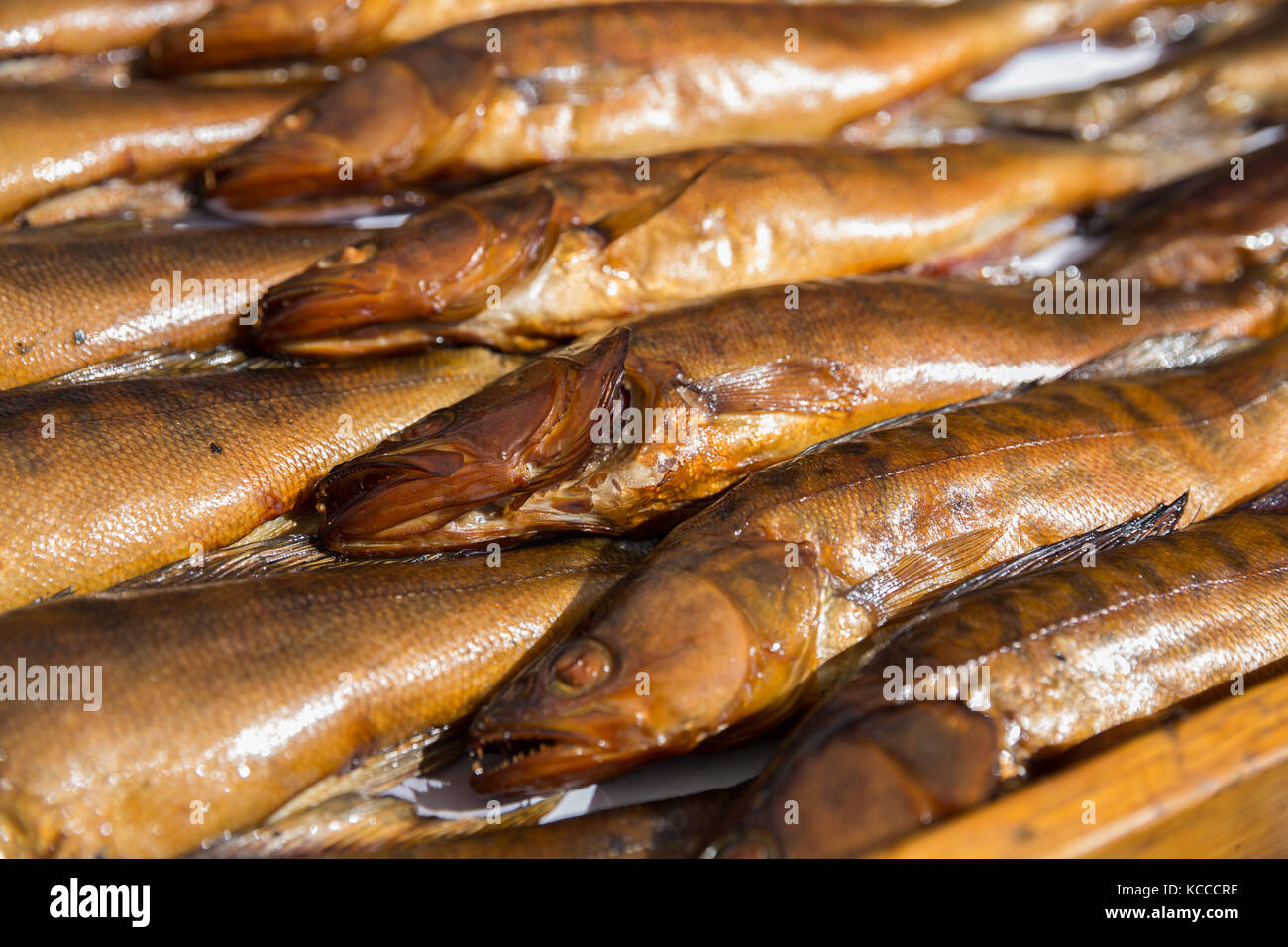 Pike perch smoked on the market, background Stock Photo - Alamy