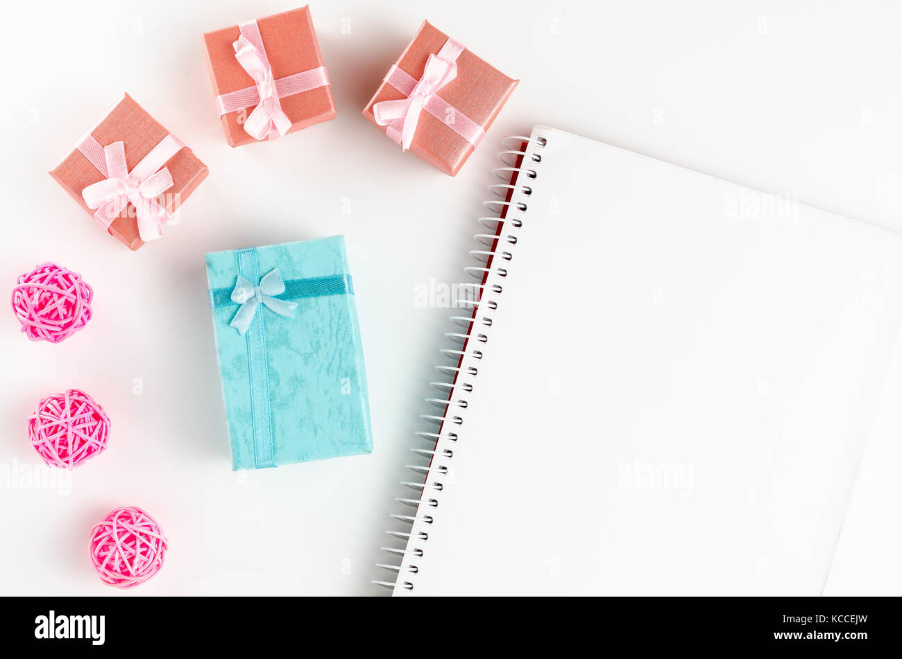 Festive composition. boxes with gifts and note, on a white table with ...