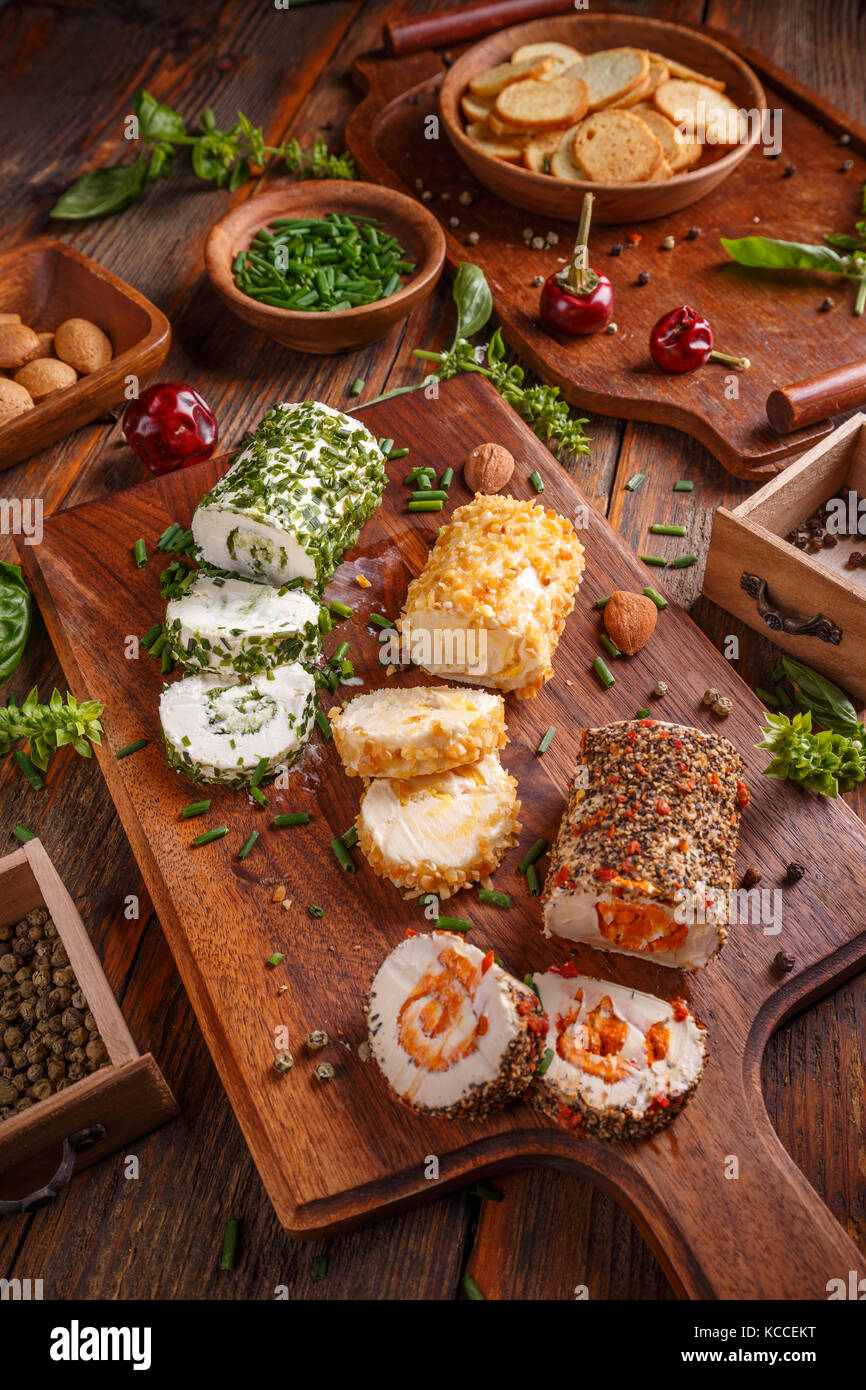 3 mini cheese appetizers covered with spices and chive pieces Stock ...