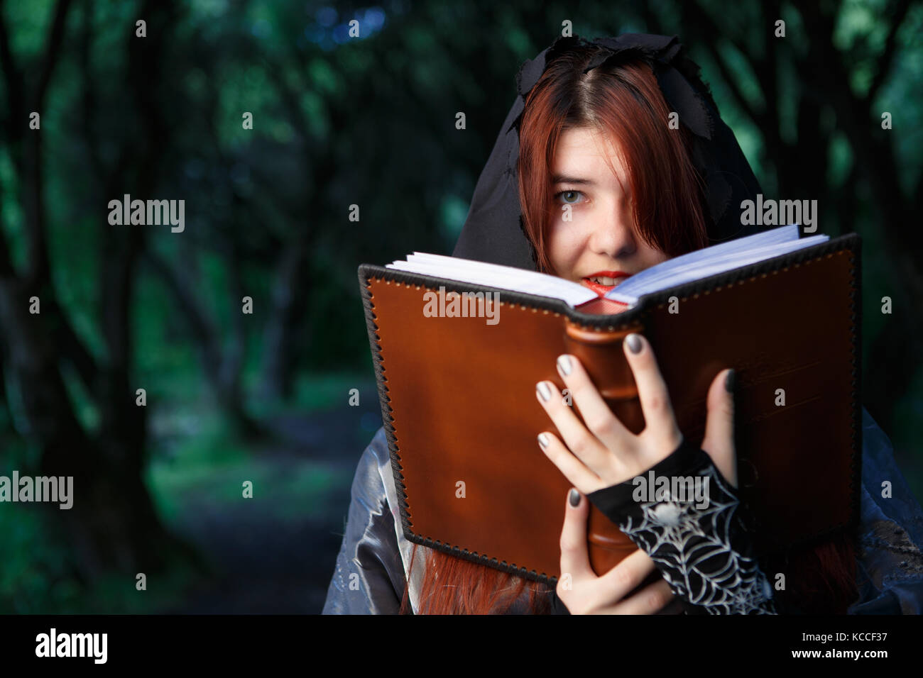 Photo of witch in black hood Stock Photo - Alamy