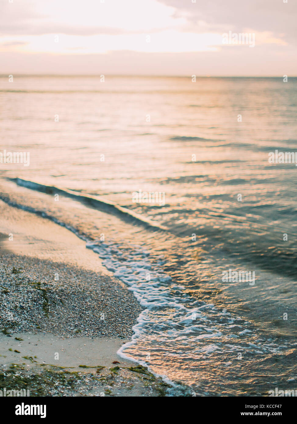 The side view of the seascape during the sunset Stock Photo - Alamy