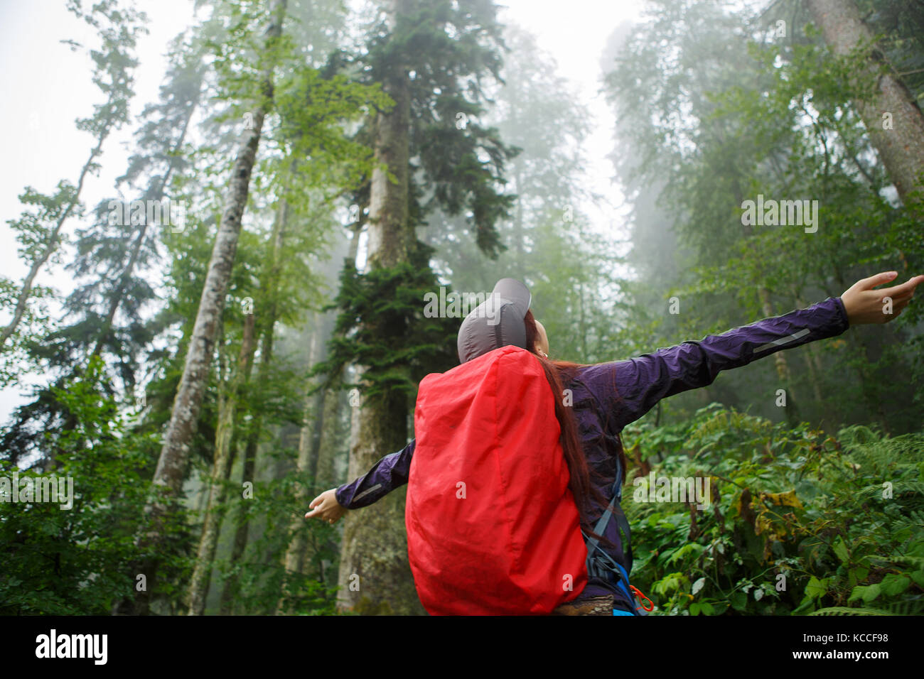 Woman arms raised stands hi-res stock photography and images - Alamy