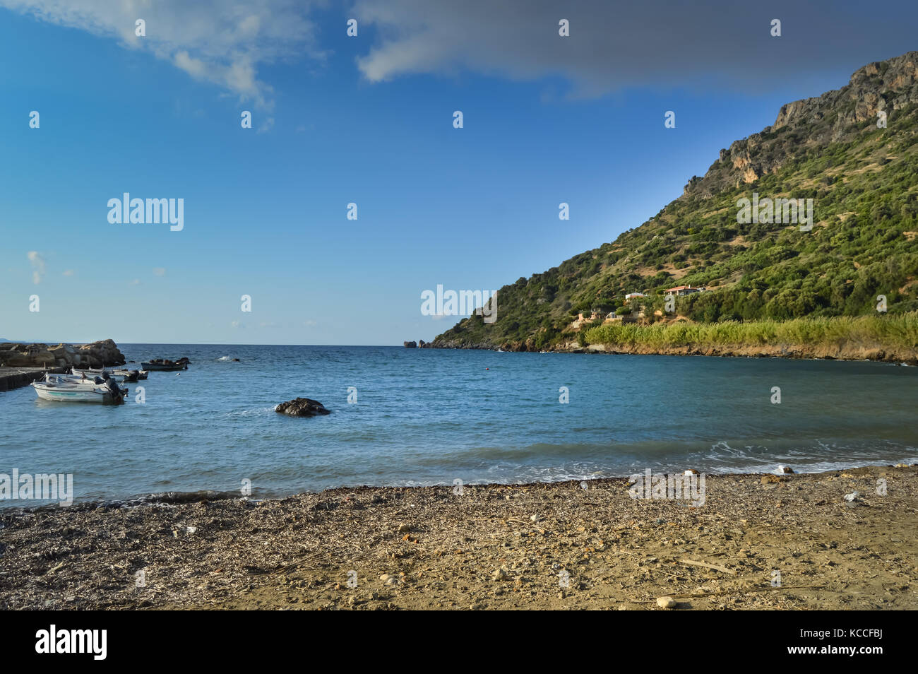 Panorama on the ocean and a traditional fishing boat in the village of ...