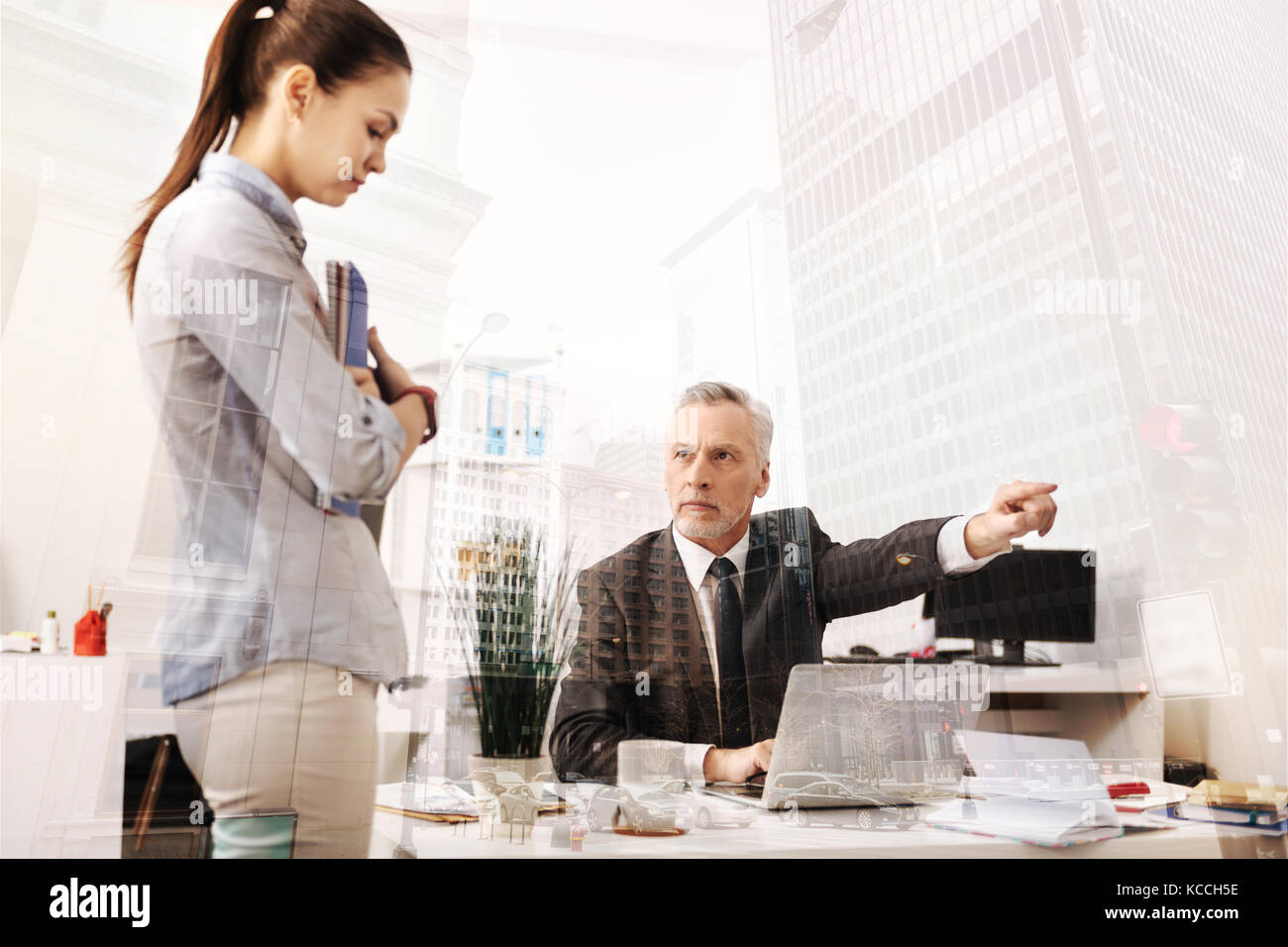 Strict boss dismissing his employee Stock Photo - Alamy