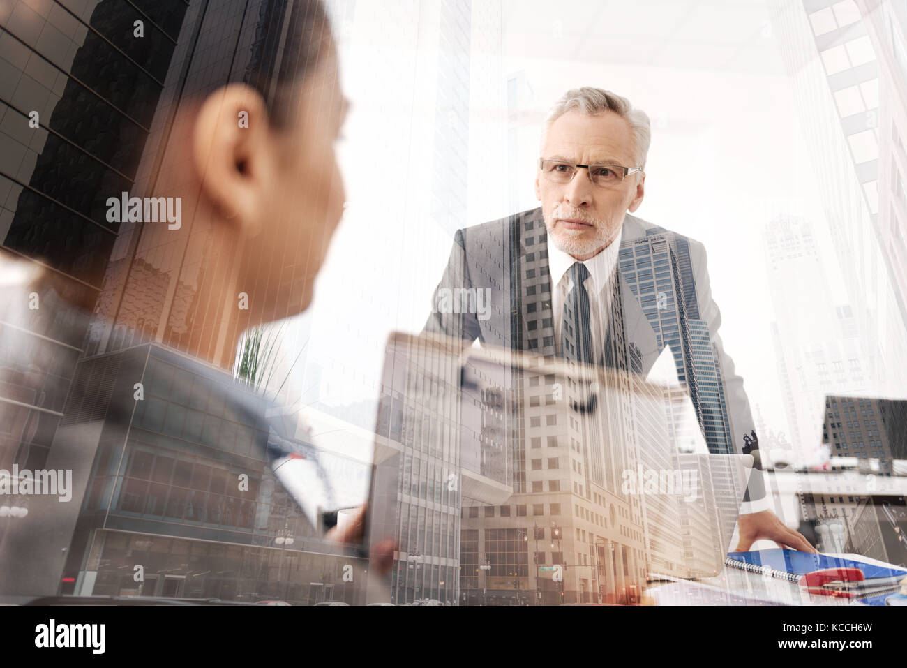 Strict professional boss feeling angry with his female worker Stock ...