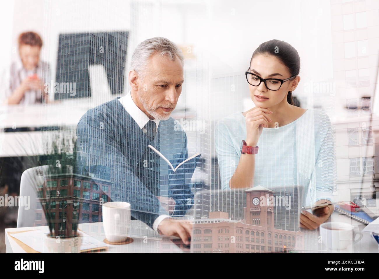 Professional office workers sitting at the table Stock Photo - Alamy Professional office workers sitting at the table Stock Photo - Alamy