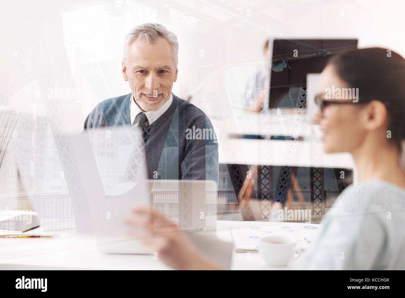 Positive senior man talking with his colleague Stock Photo - Alamy