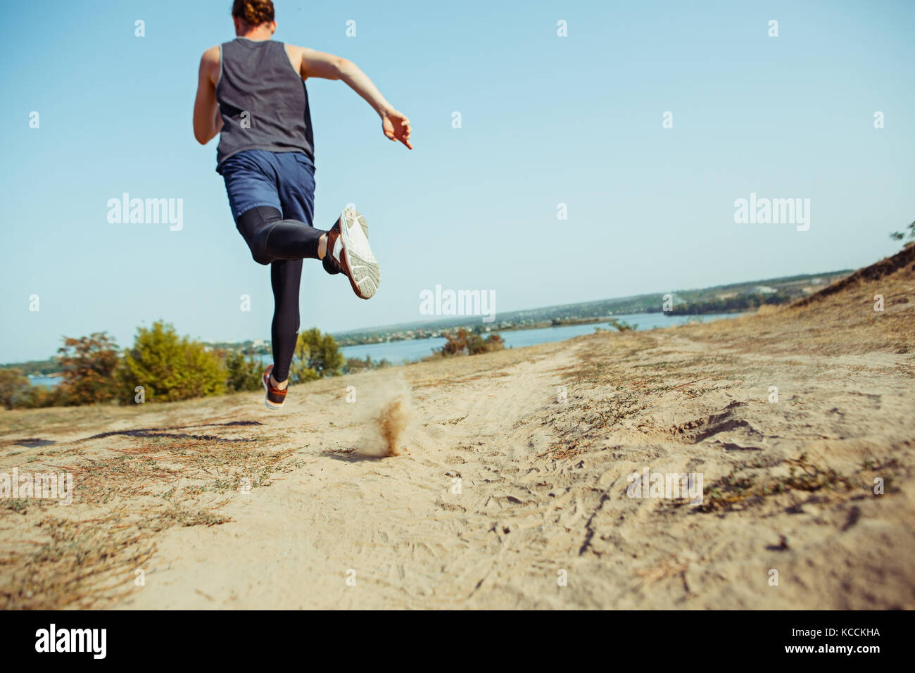 Running sport. Man runner sprinting outdoor in scenic nature. Fit ...