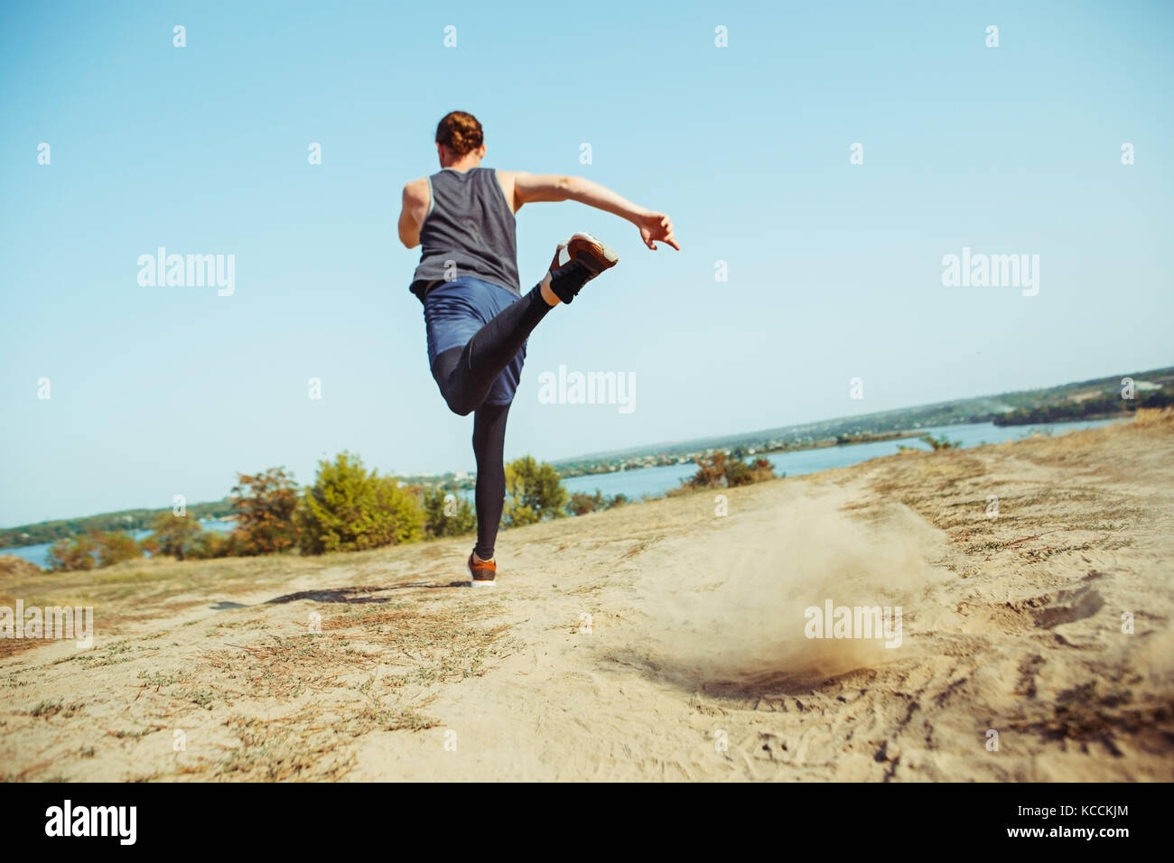 Running sport. Man runner sprinting outdoor in scenic nature. Fit ...