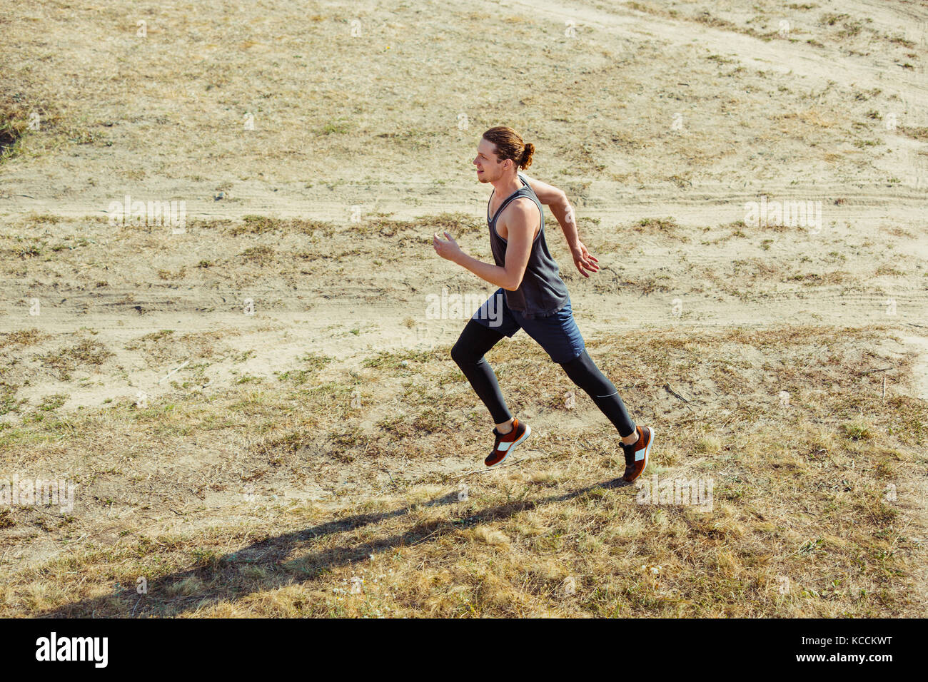 Running sport. Man runner sprinting outdoor in scenic nature. Fit ...