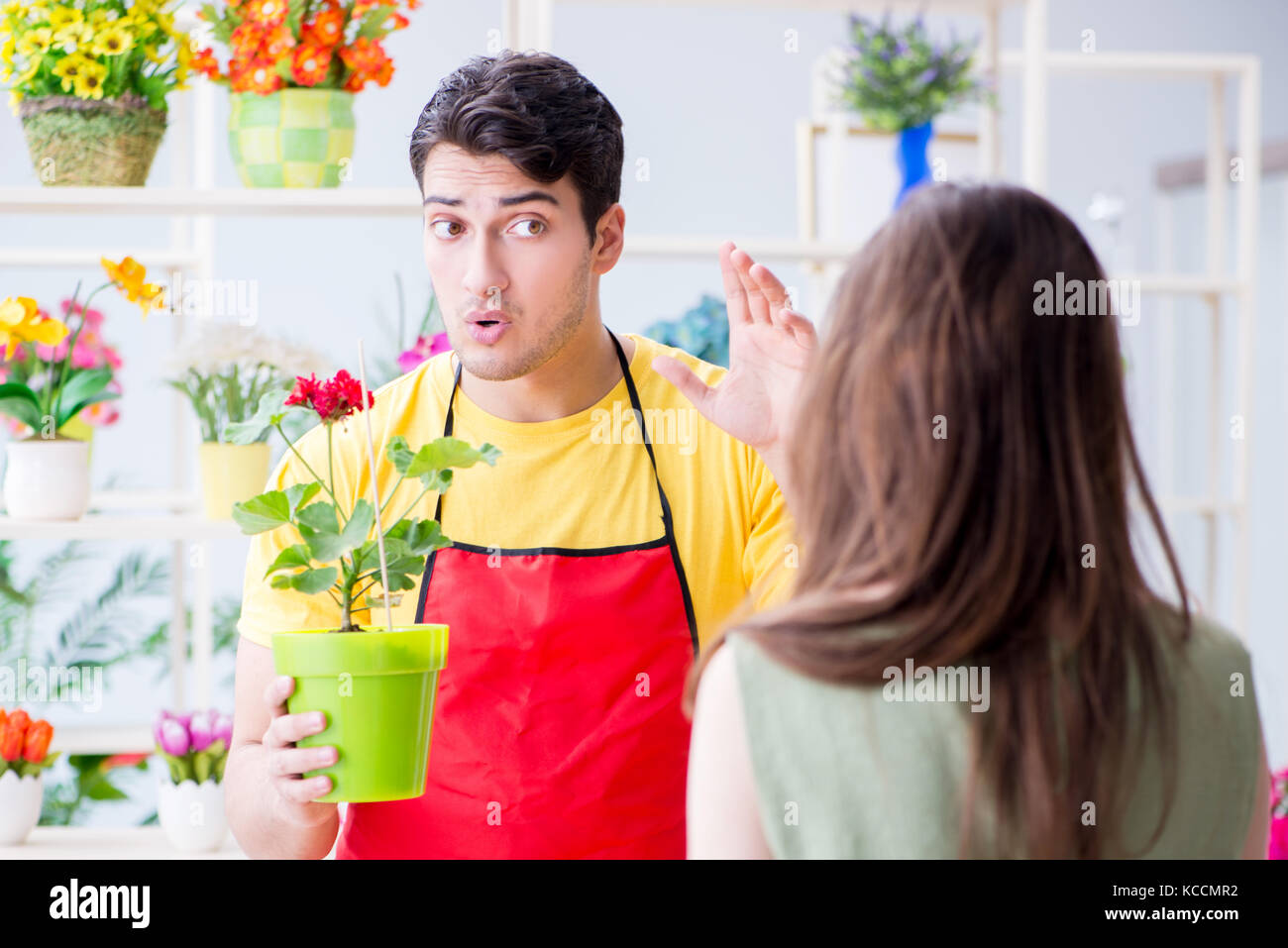 Florist selling flowers in a flower shop Stock Photo - Alamy