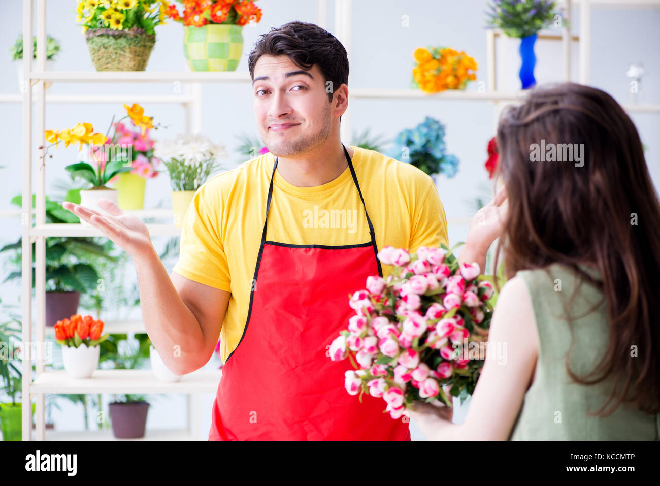 Florist selling flowers in a flower shop Stock Photo - Alamy