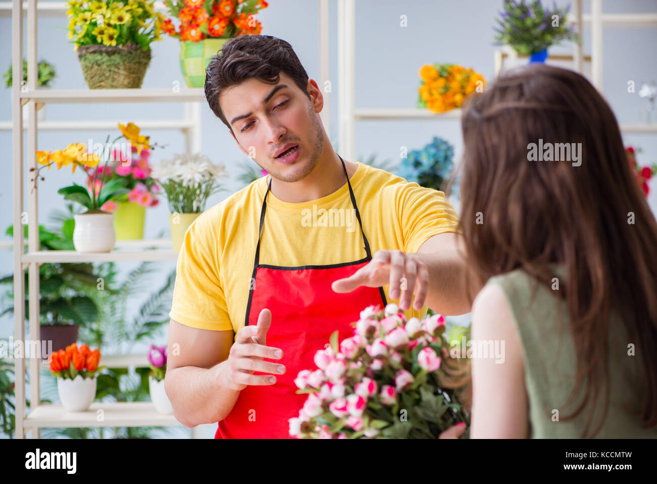 Florist selling flowers in a flower shop Stock Photo - Alamy