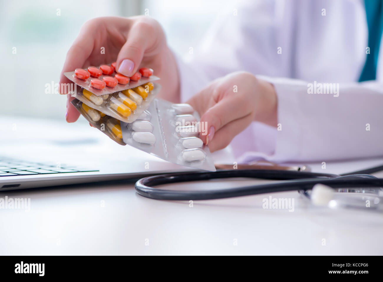 Medical concept with medicines and laptop computer Stock Photo - Alamy