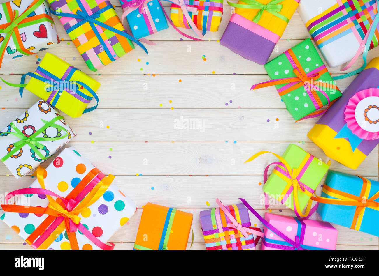 Colored gift boxes with colorful ribbons. White background. Gifts for ...