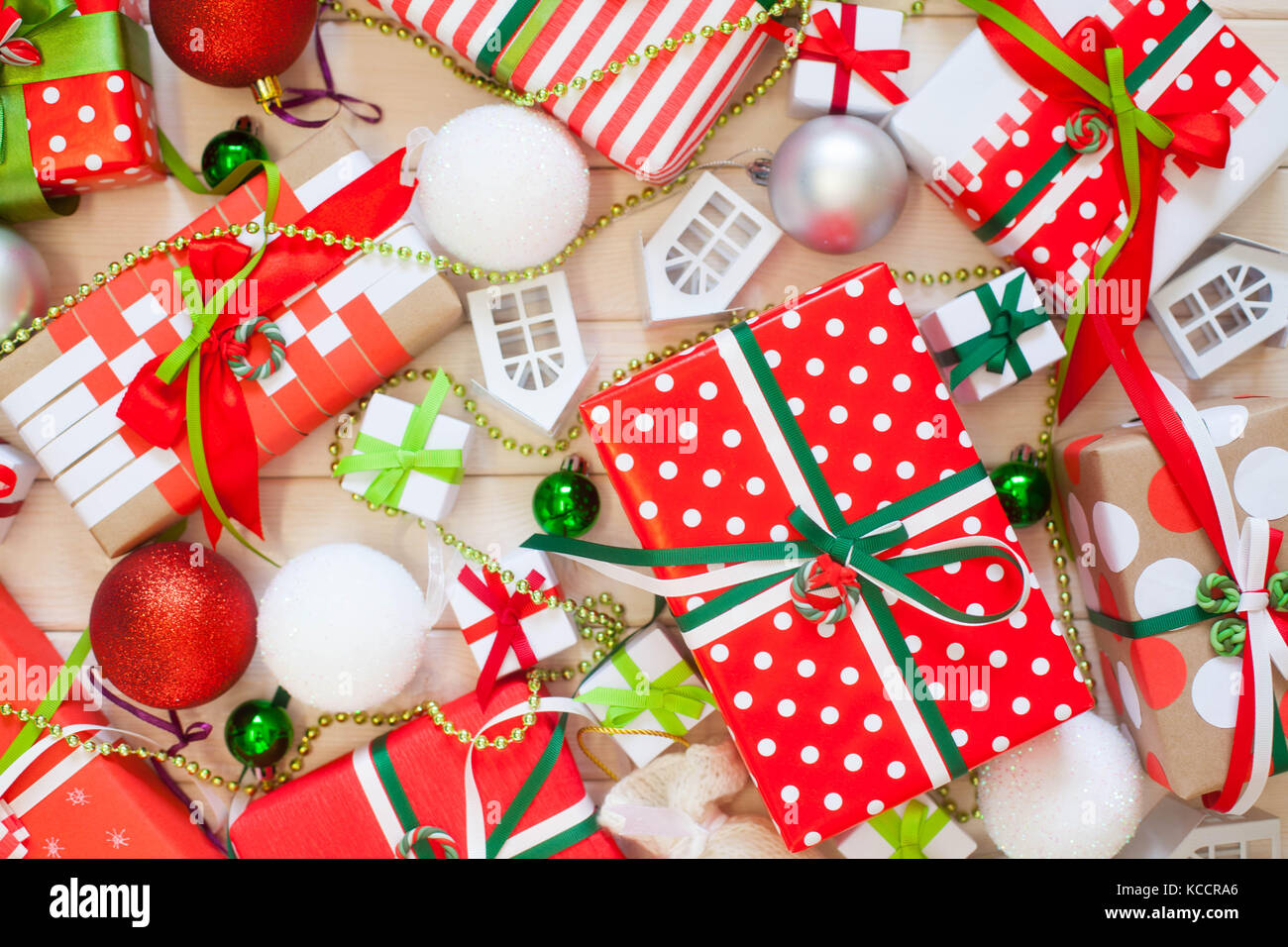 Christmas presents in red packaging. Satin colored ribbons. Background ...