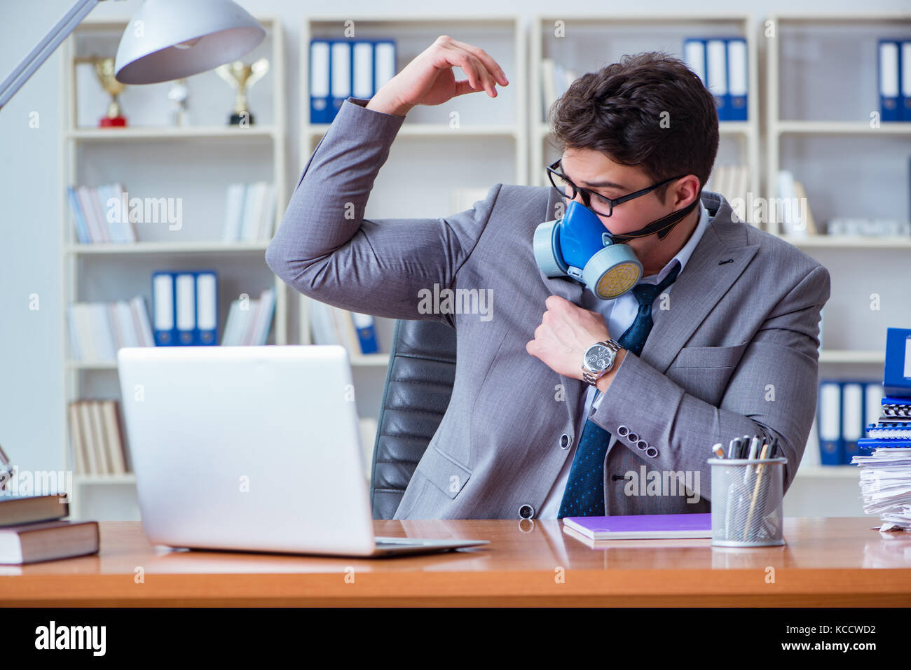 Businessman sweating excessively smelling bad in office at workplace ...