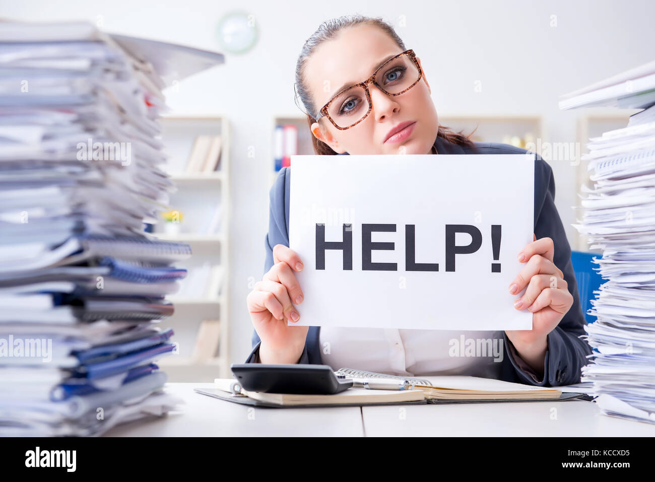 Businesswoman pleading for help in office Stock Photo - Alamy