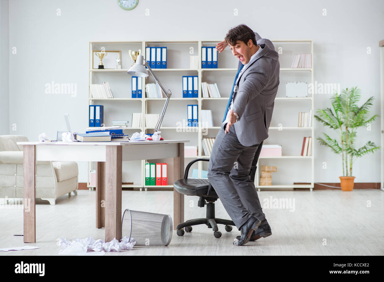 Businessman having fun taking a break in the office at work Stock Photo ...