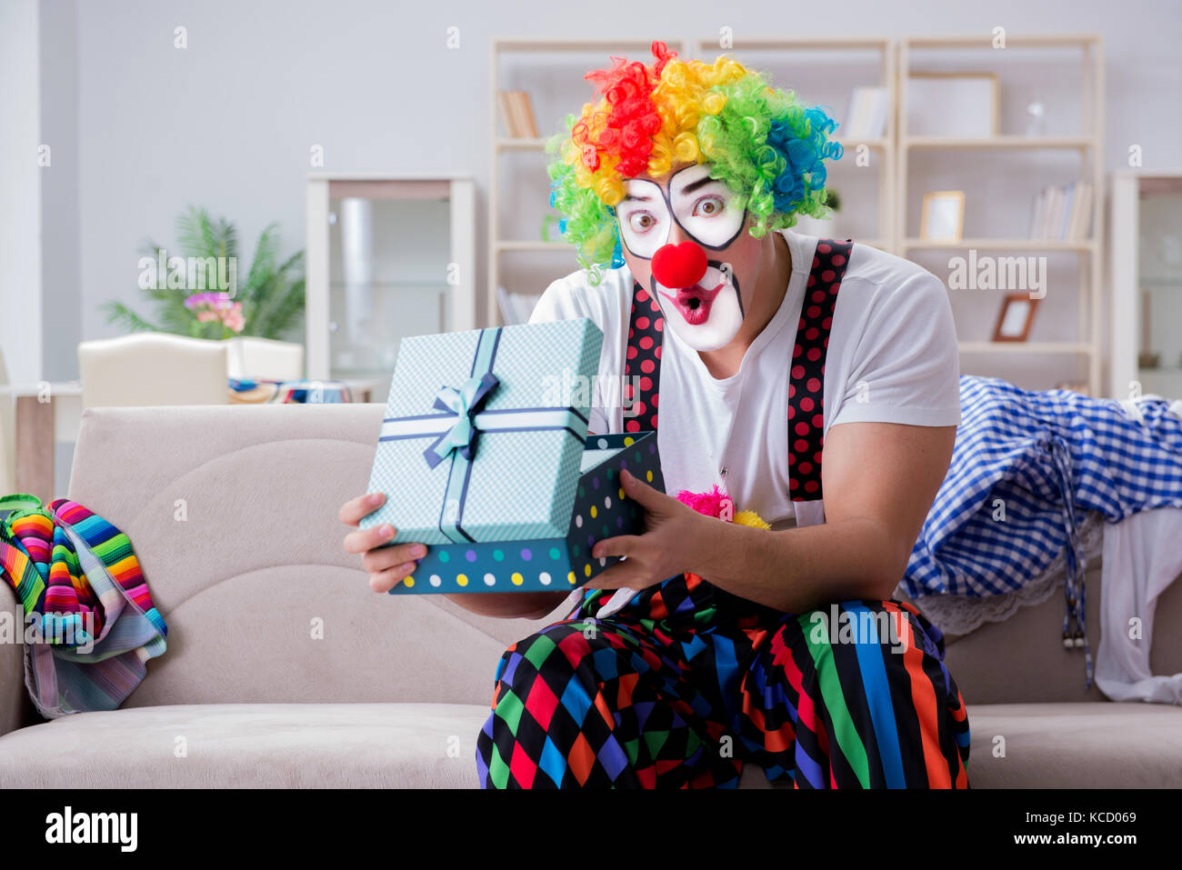 Drunk clown celebrating having a party at home Stock Photo - Alamy