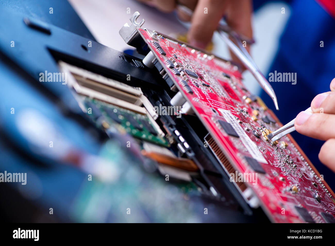 Repairman working in technical support fixing computer laptop ...