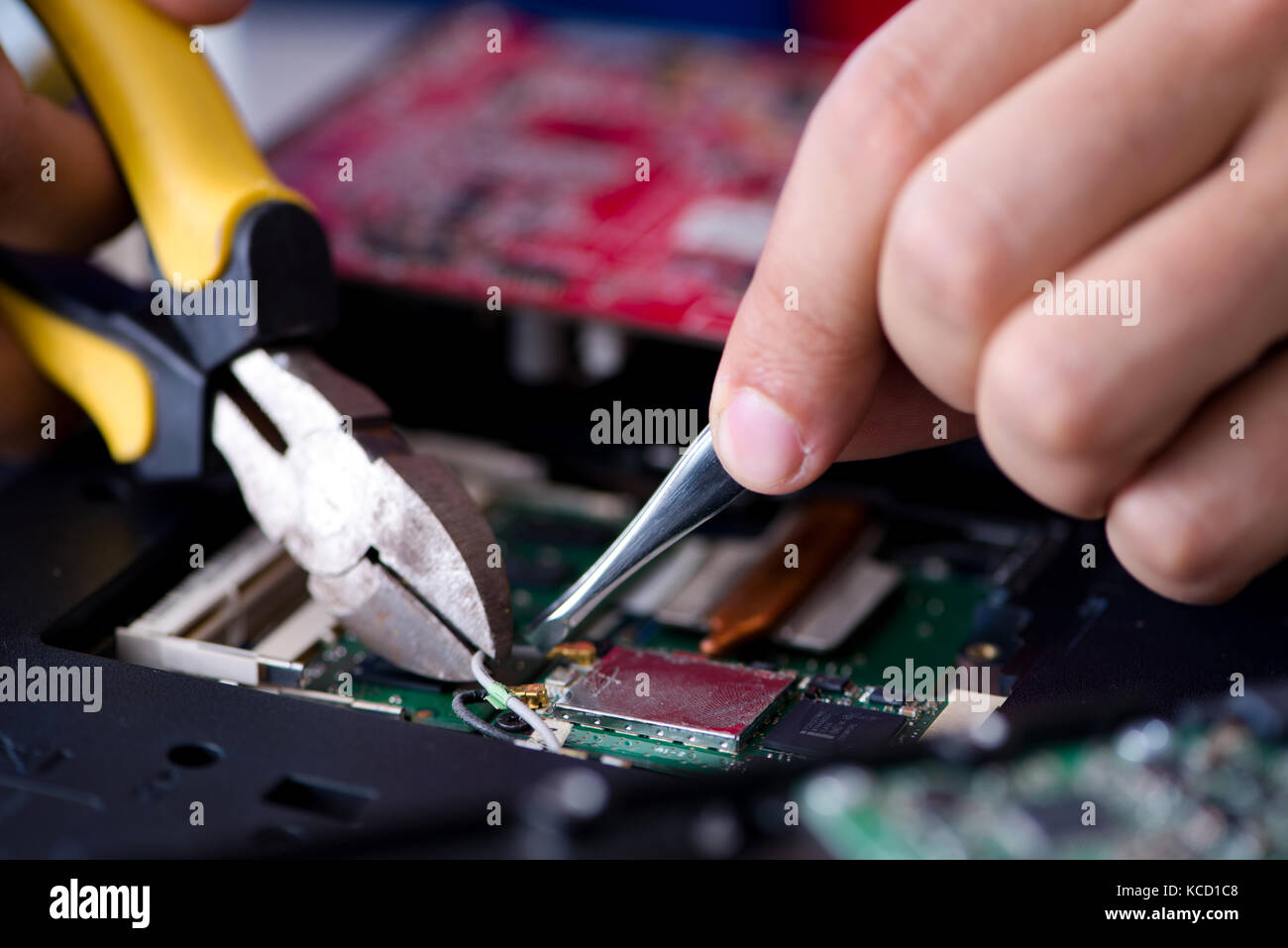 Repairman working in technical support fixing computer laptop ...