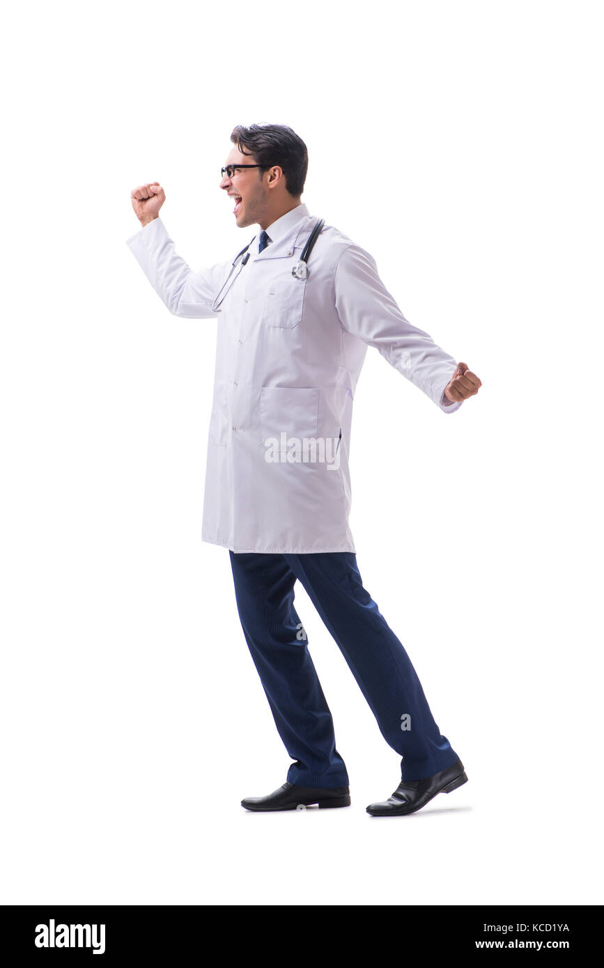 Young doctor physician standing walking isolated on white background ...
