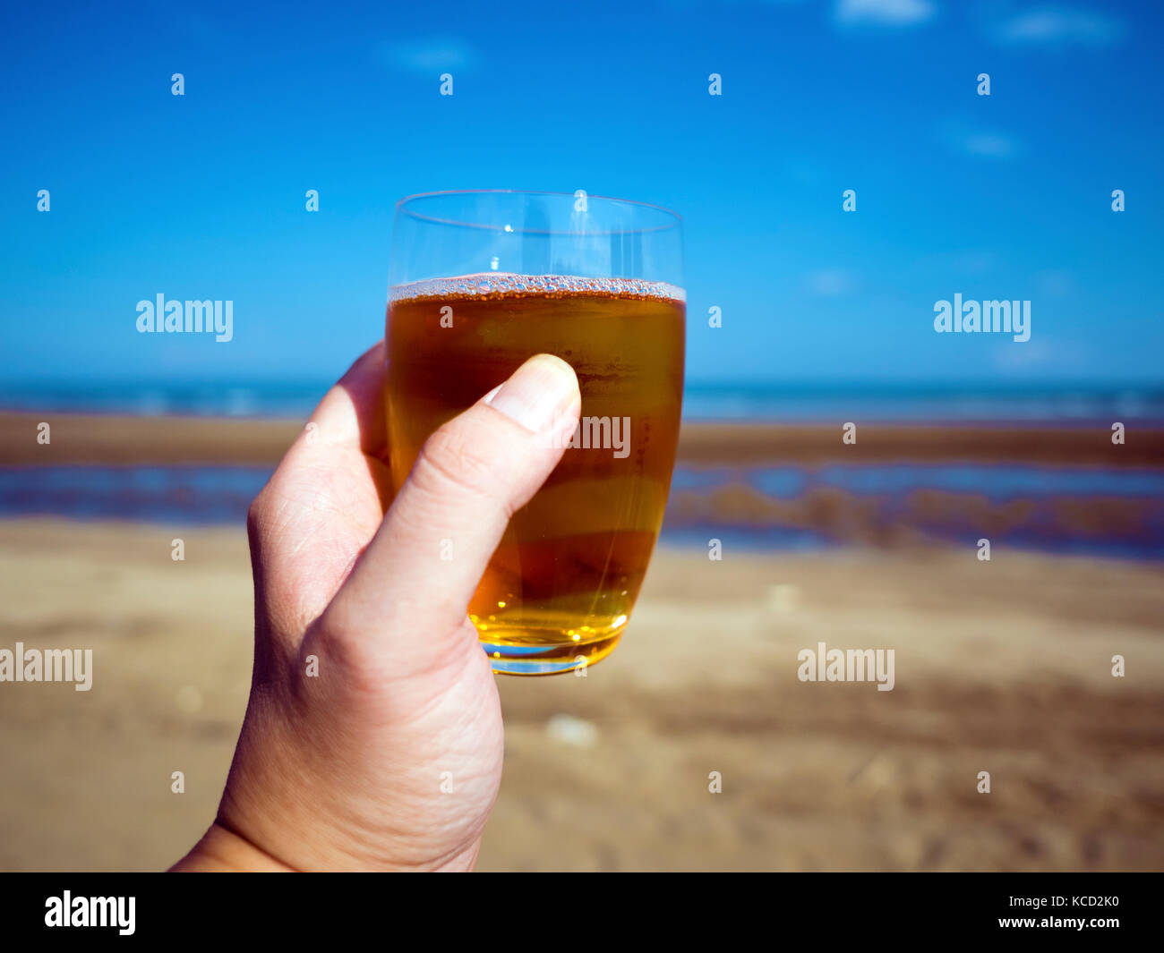 glass of tea at summer beach Stock Photo - Alamy