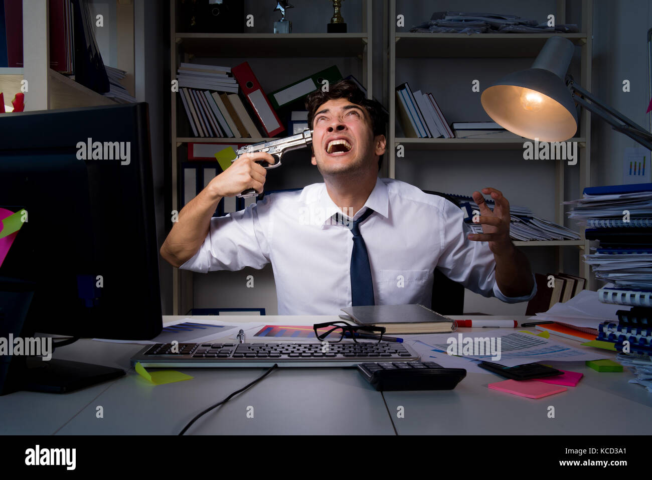 Man businessman working late hours in the office Stock Photo - Alamy