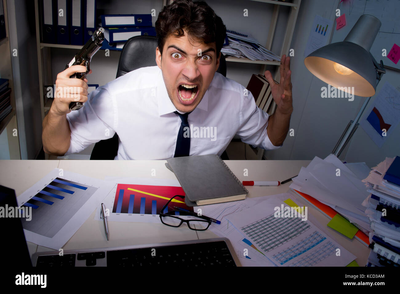 Man businessman working late hours in the office Stock Photo - Alamy