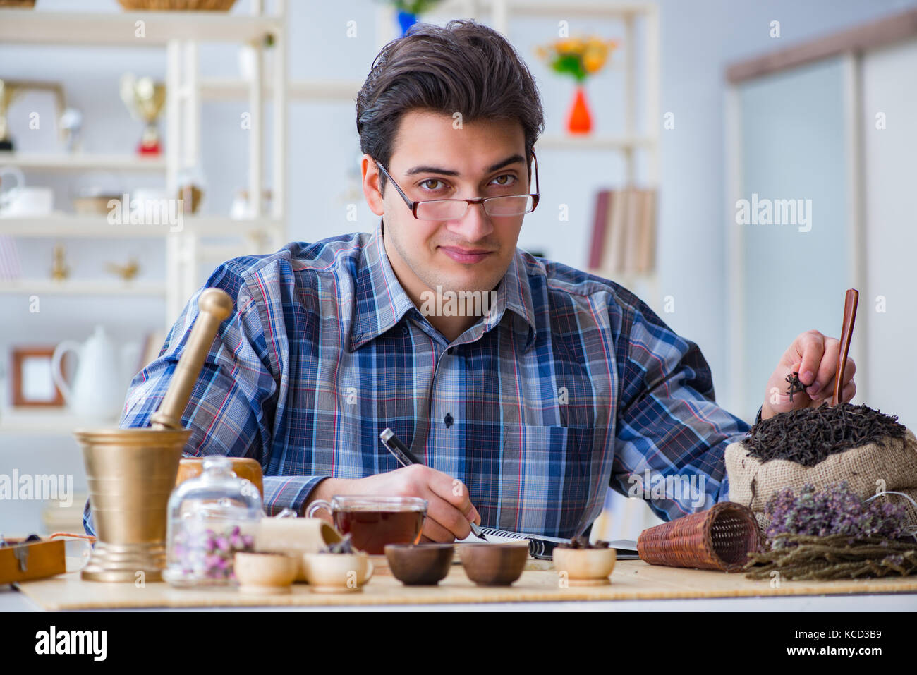 Professional tea expert trying new brews Stock Photo - Alamy