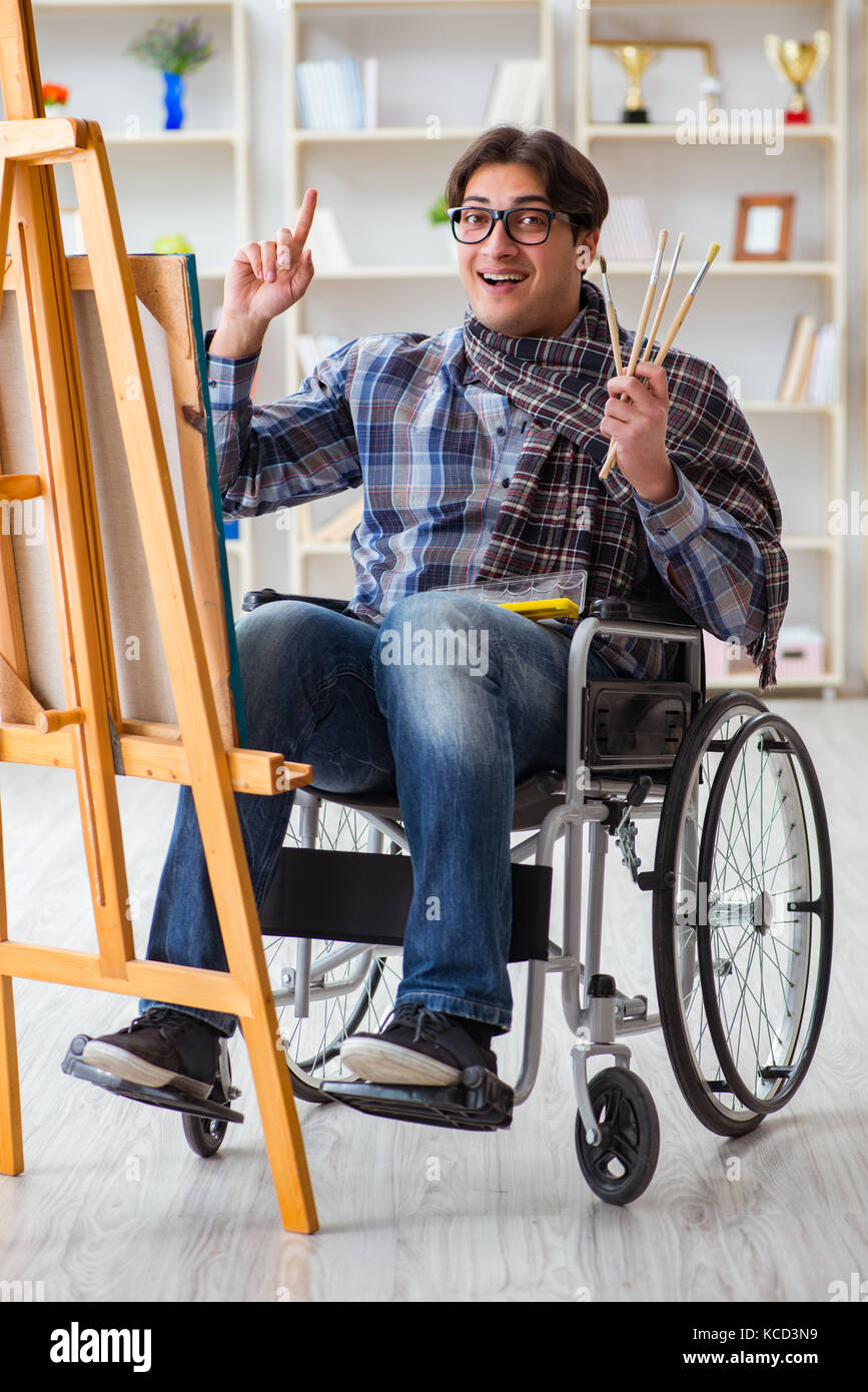 Disabled artist painting picture in studio Stock Photo - Alamy