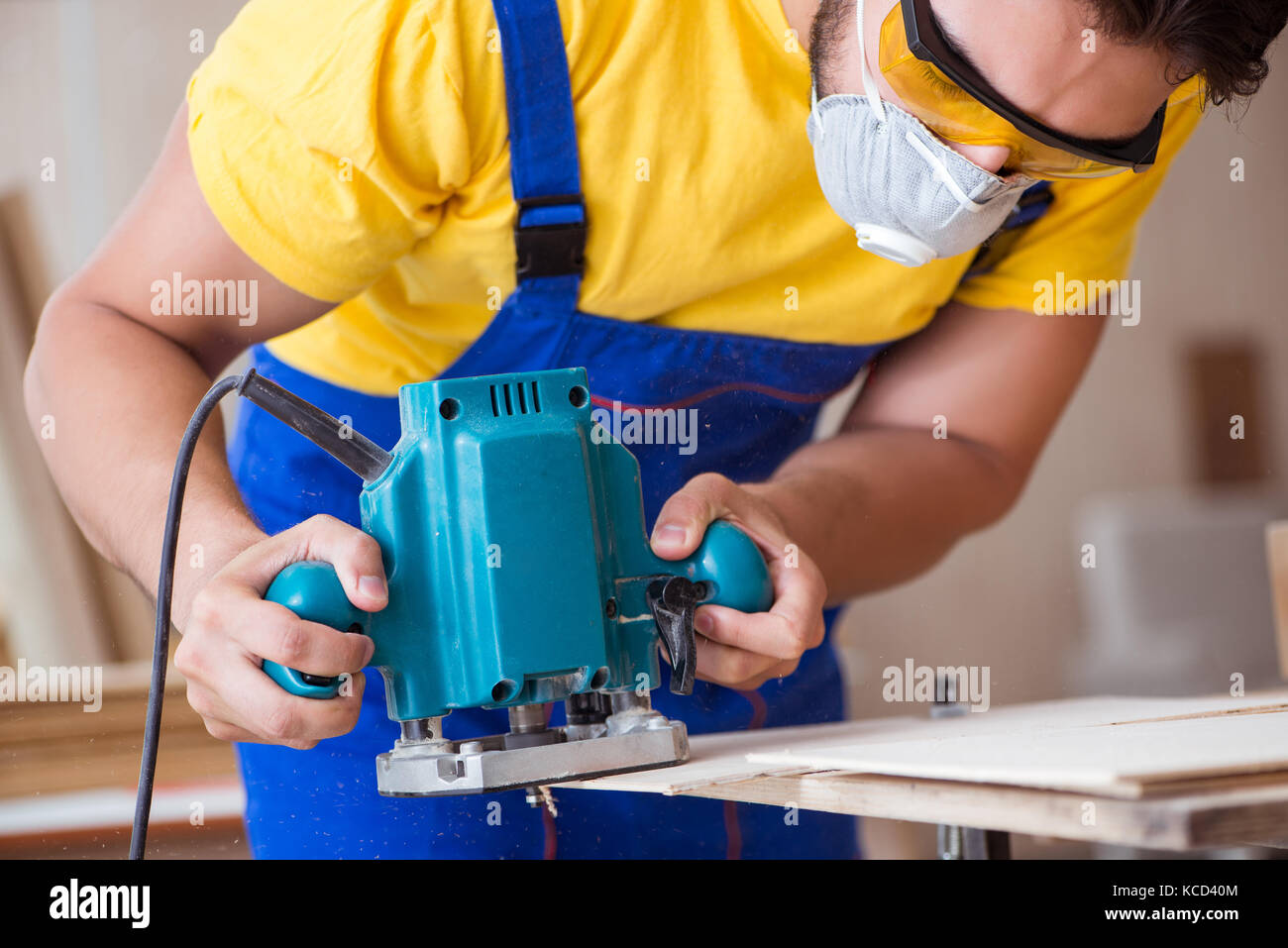 Carpenter working in the workshop Stock Photo - Alamy