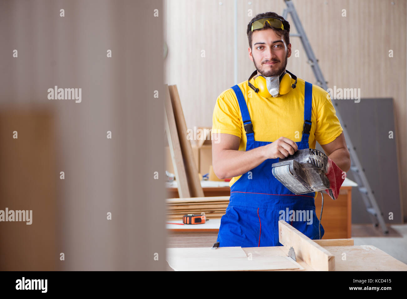 Carpenter working in the workshop Stock Photo - Alamy